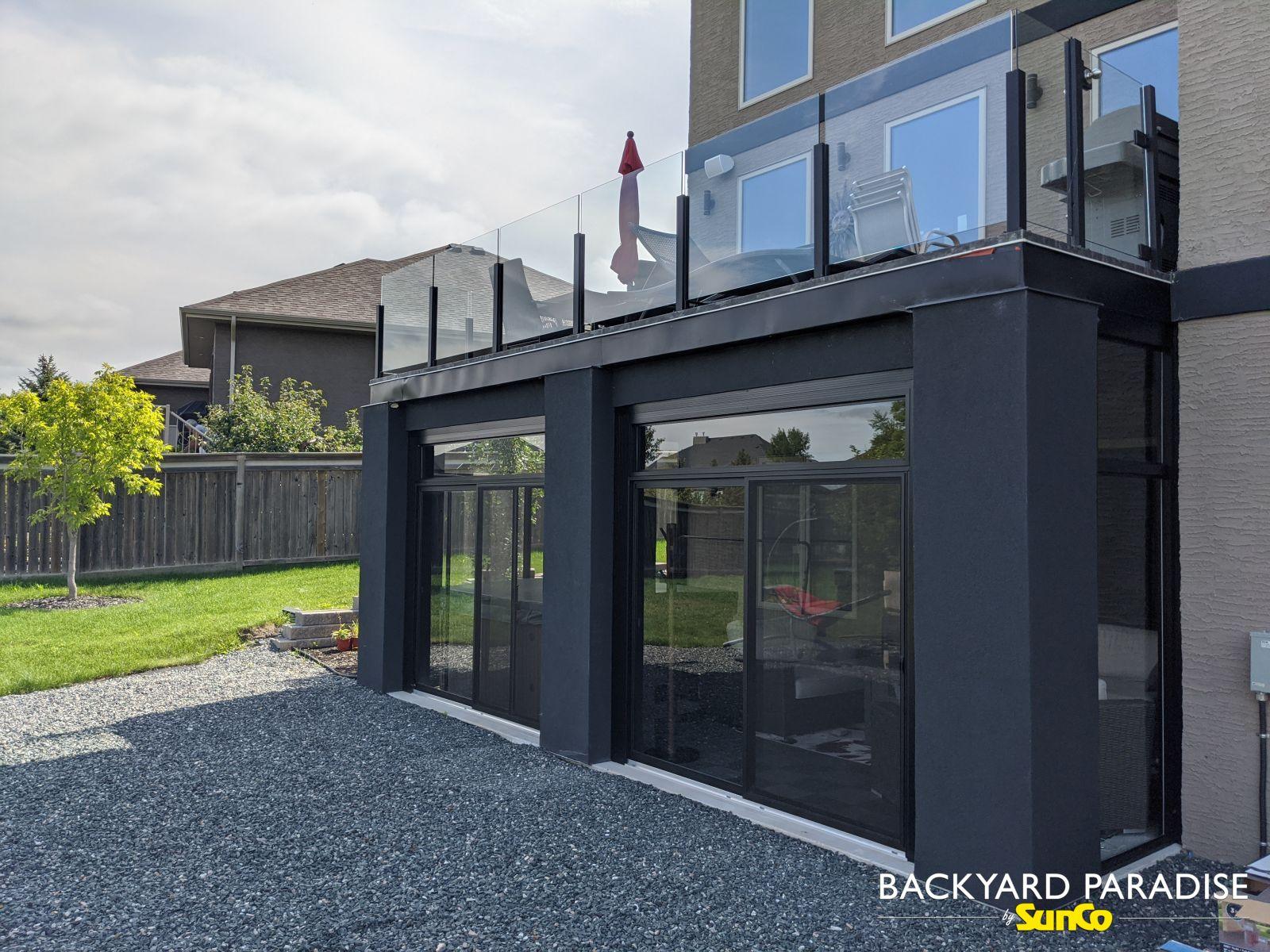 Black curtain wall, walk out basement sunroom enclosure , East st Paul ...